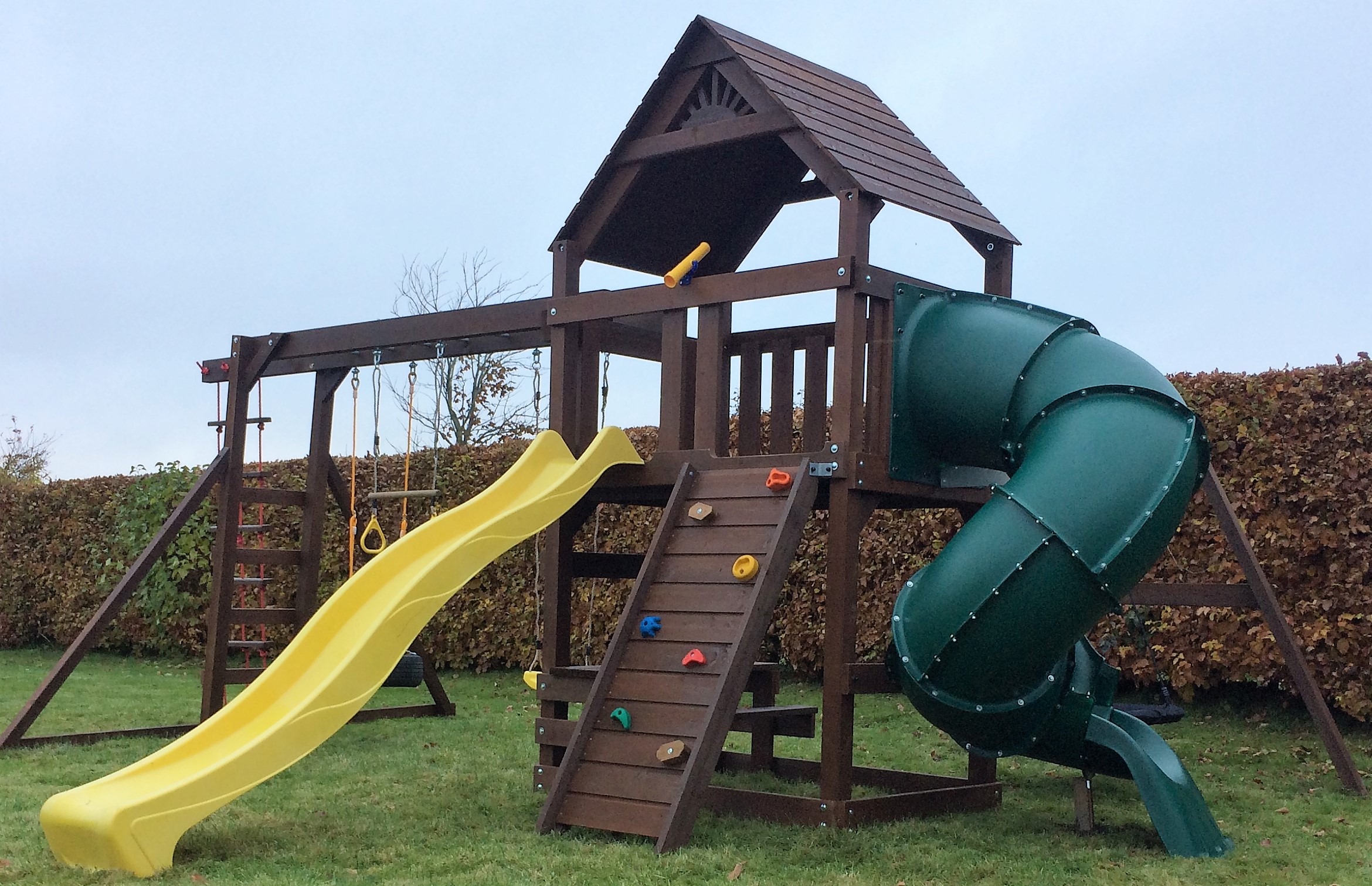 Climbing frame spiral tube slide monkey bars nest swing