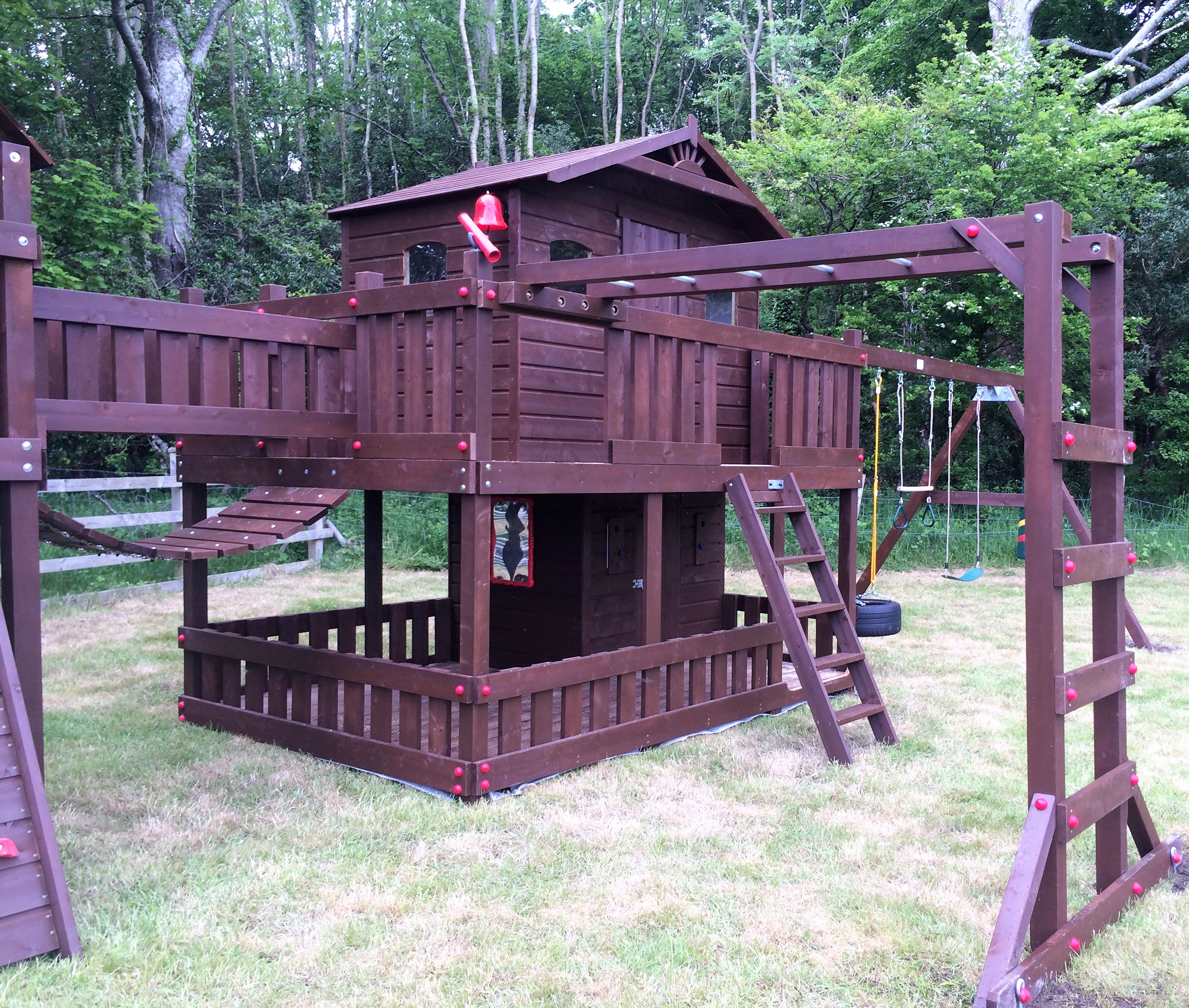 Large tree house,spiral tube slide,monkey bar beam,swing set,